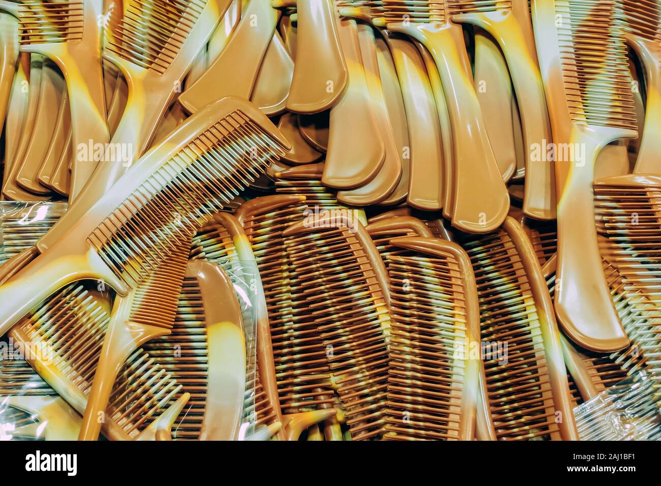 Top view of many brown plastic comb for sale at the local market Stock ...