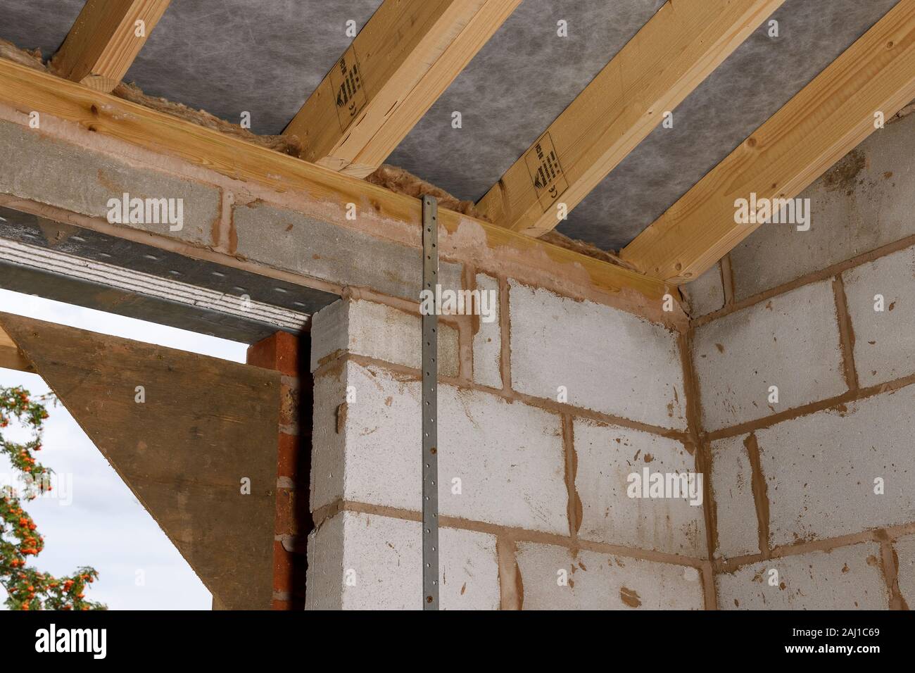 Close up detail showing a timber roof structure on a clockwork wall on ...