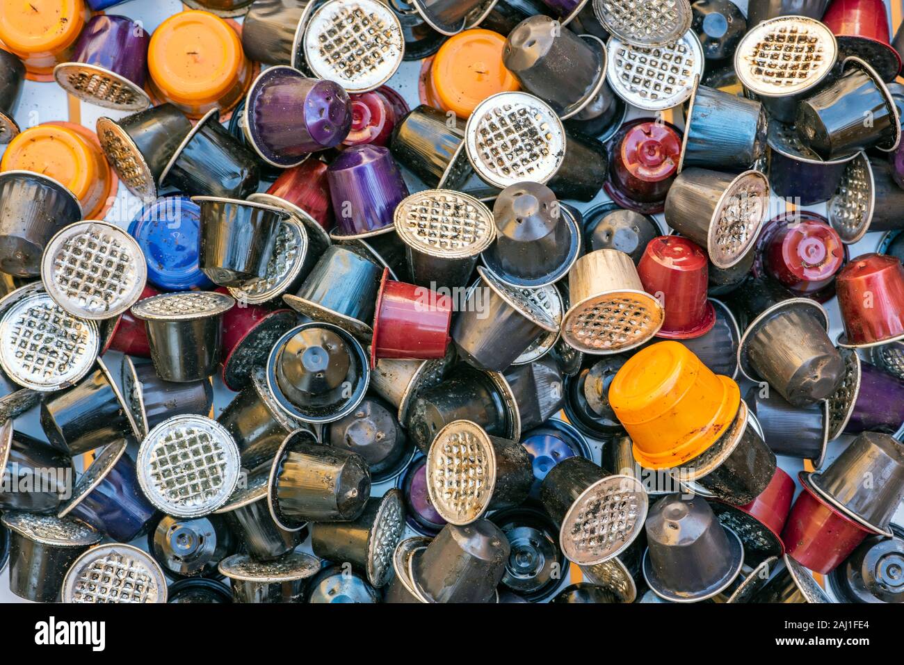 Used coffee capsules of various colors and flavors. These capsules are ...