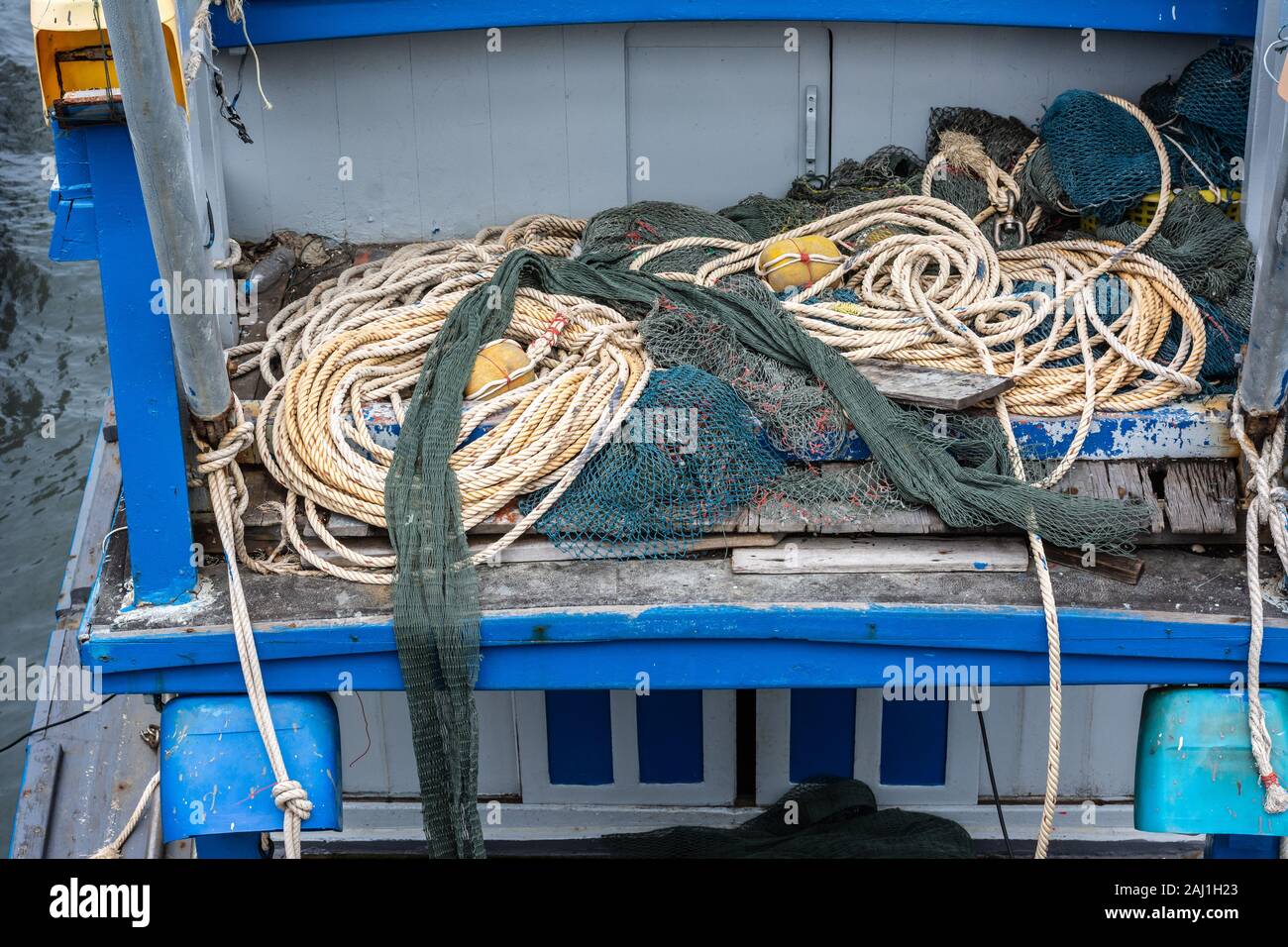 Fishing boat anchored in the harbor Stock Photo - Alamy
