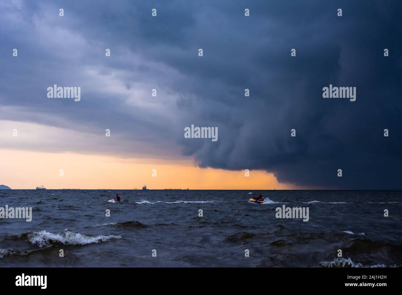 Approaching storm cloud with rain over the sea Stock Photo - Alamy