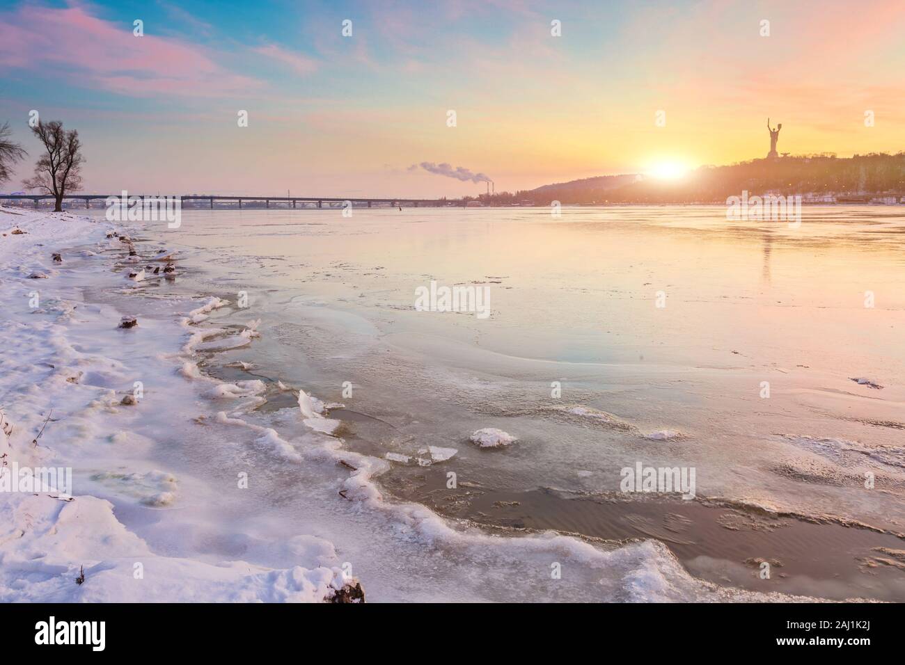 Cold Winter night cityscape with illuminated buildings in Kiev, Ukraine ...