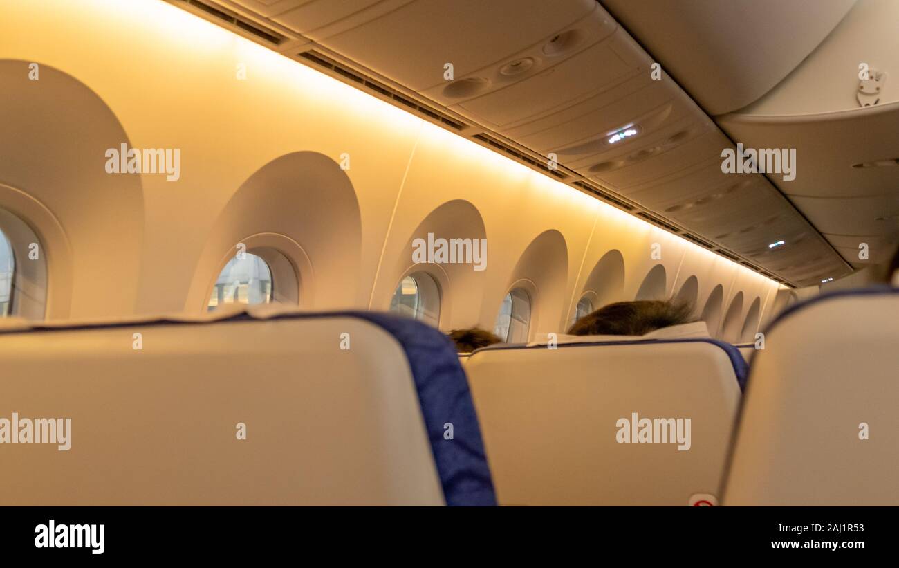 Seating interior of an airplane cabin Stock Photo - Alamy