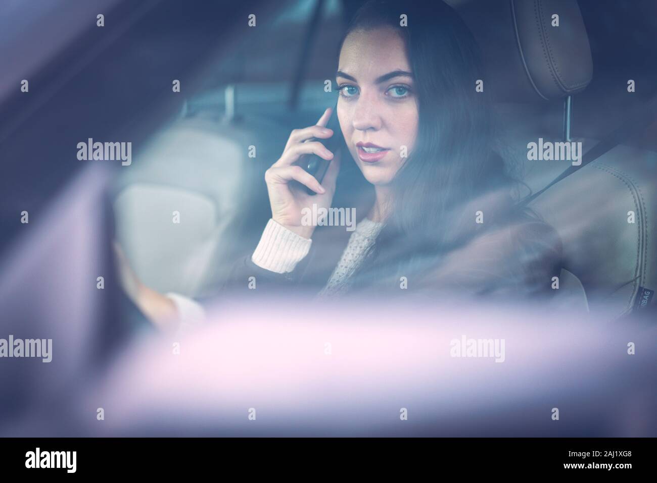 Woman driving talking on mobile hi-res stock photography and images - Alamy