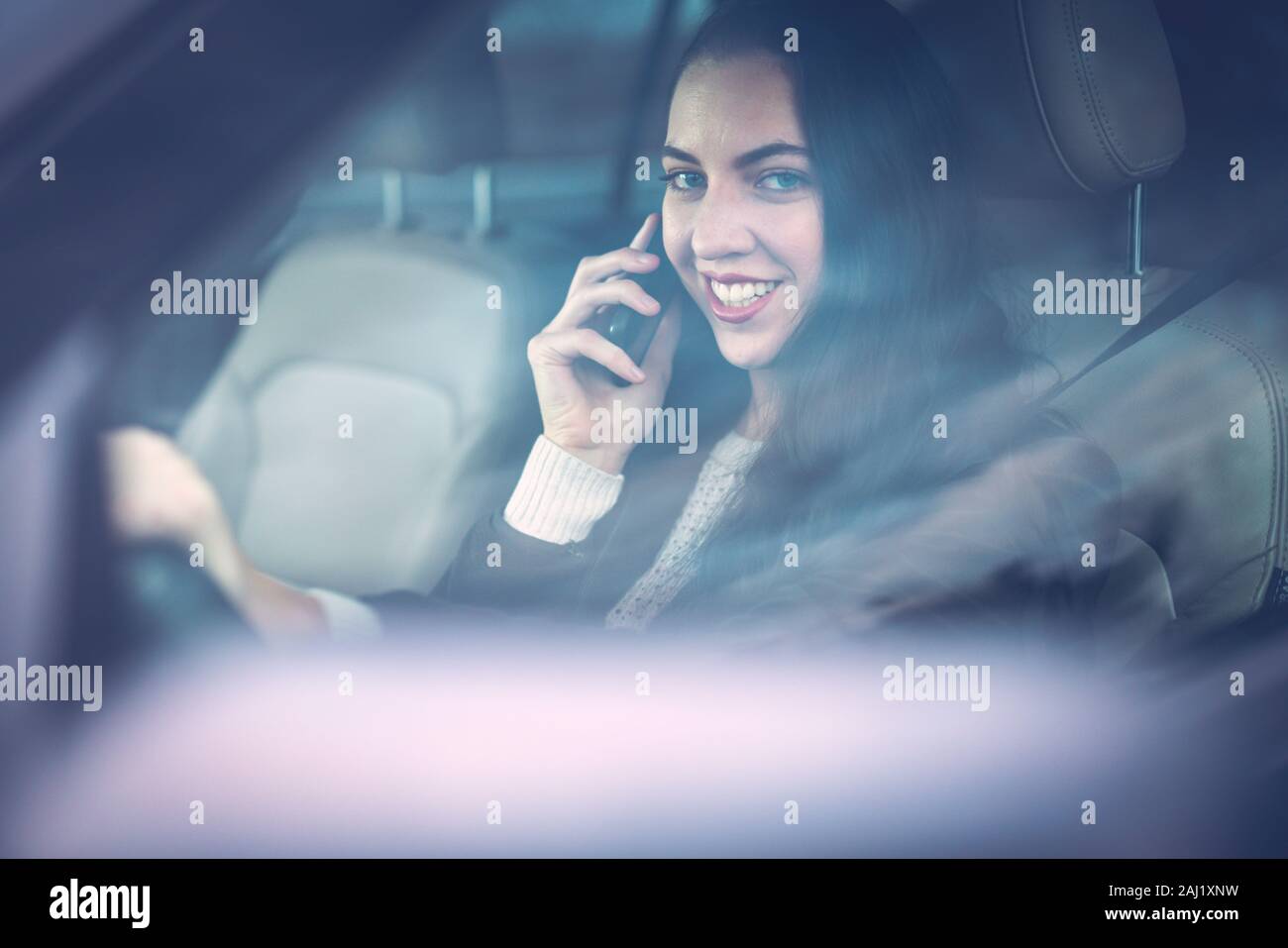 Woman driving talking on mobile hi-res stock photography and images - Alamy