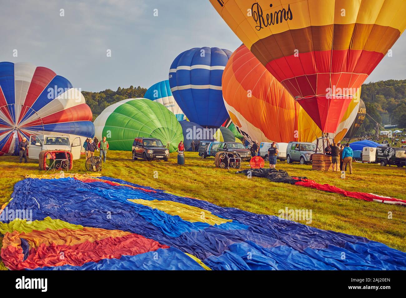 Hot-air balloons preparing to take off from the festival site during ...