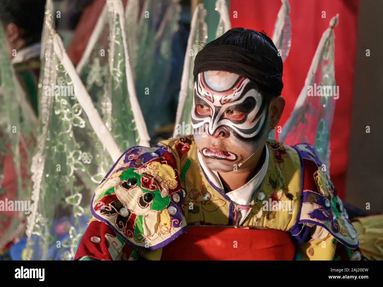 An actor waiting backstage before a performance of Vietnamese opera ...