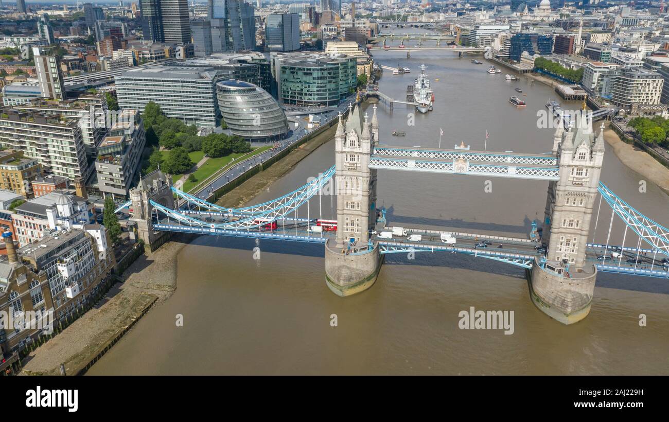 London Tower Bridge with Red buses traveling in traffic Stock Photo - Alamy