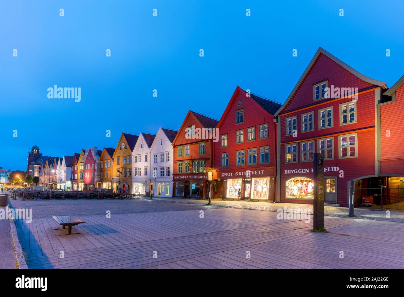 Illuminated timber buildings at dusk, Bryggen, UNESCO, Bergen ...
