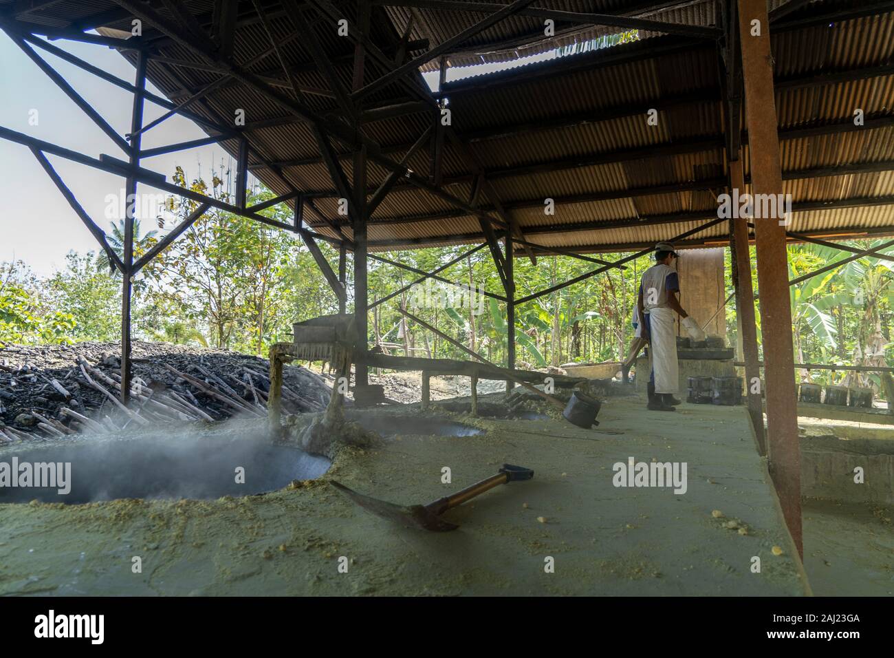 Boiling liquid sulphur releases poisonous gas in a processing factory ...