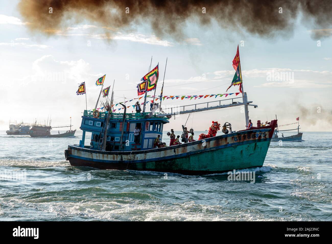A fishing trawler at sea, taking part in the annual whale festival ...