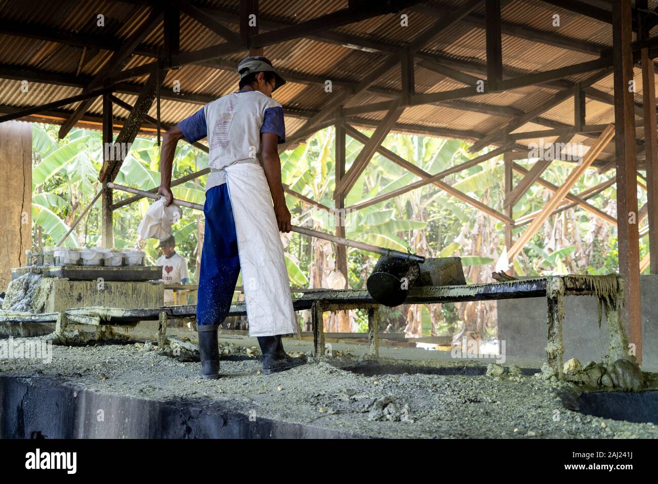 Boiling liquid sulphur is put through a filter in a sulphur processing ...