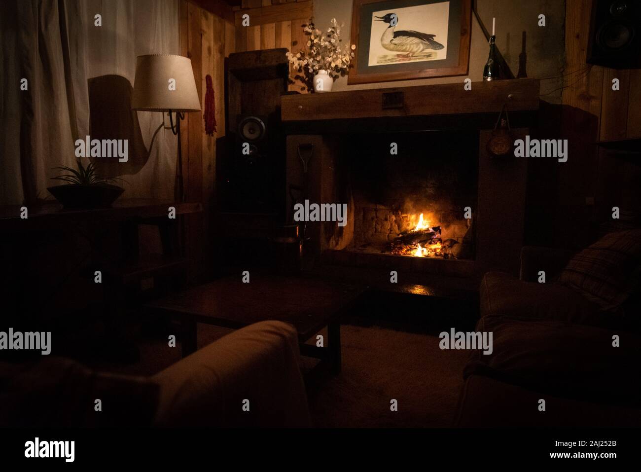 Interior of a wooden cozy and relaxing cabin with comfortable couches ...