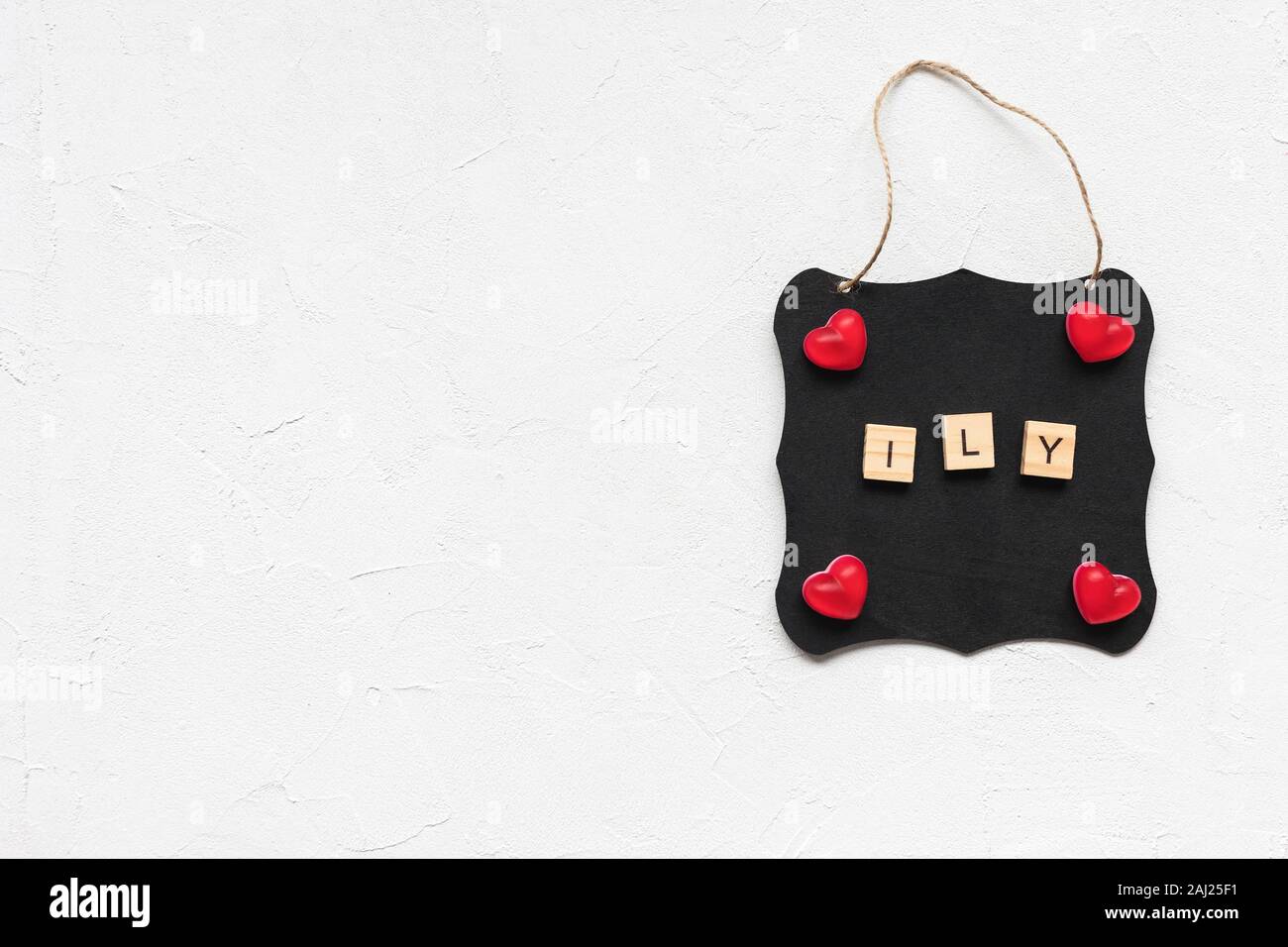 ILY leters as abbreviation of I love you and jelly hearts on a black ...