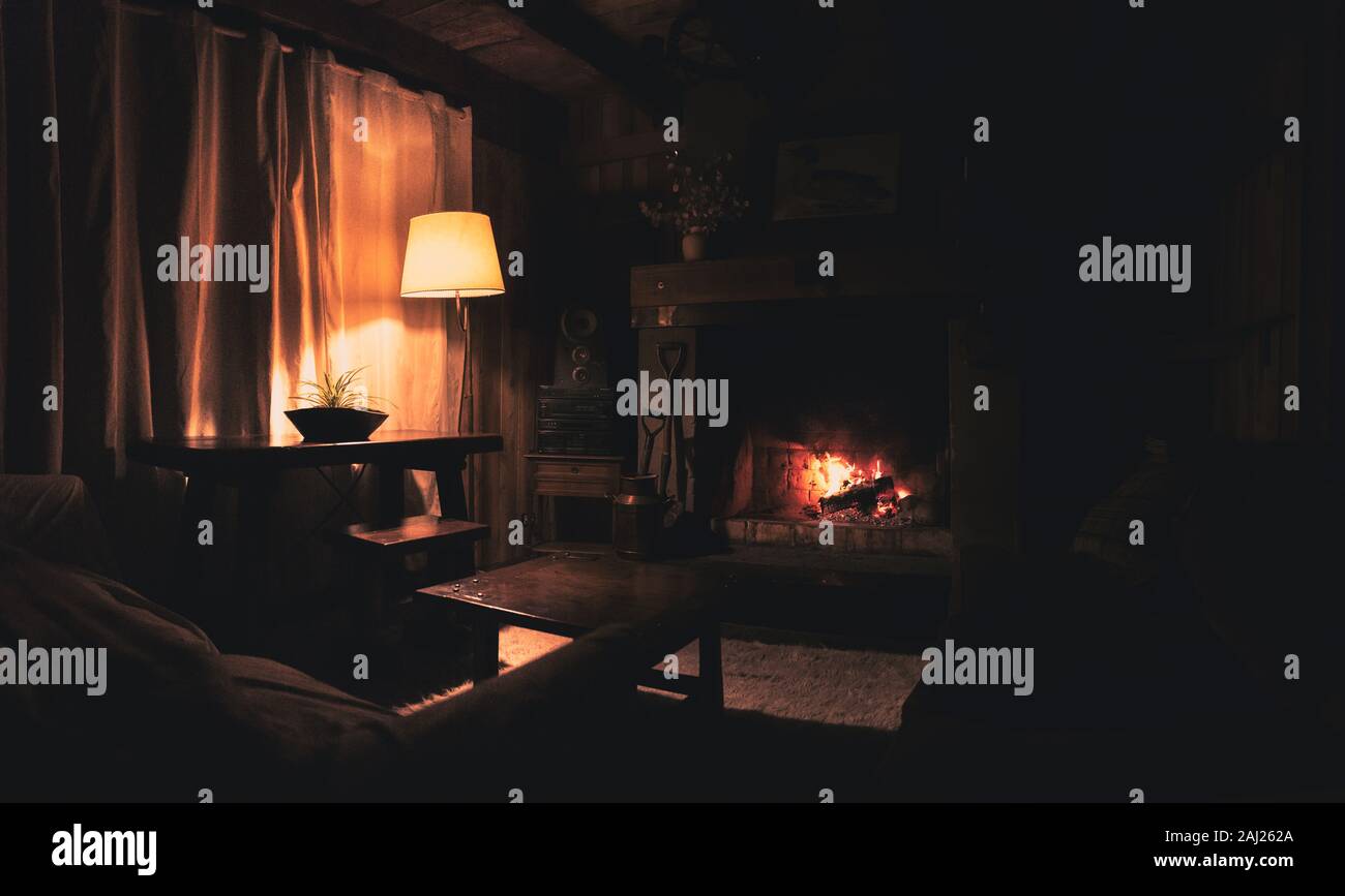 Interior of a wooden cozy and relaxing cabin with comfortable couches ...