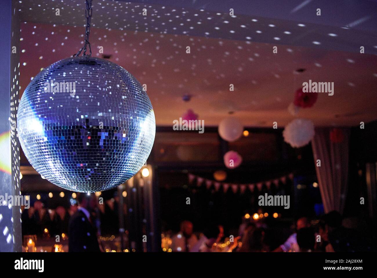 nightclub disco ball with colorful reflections Stock Photo - Alamy