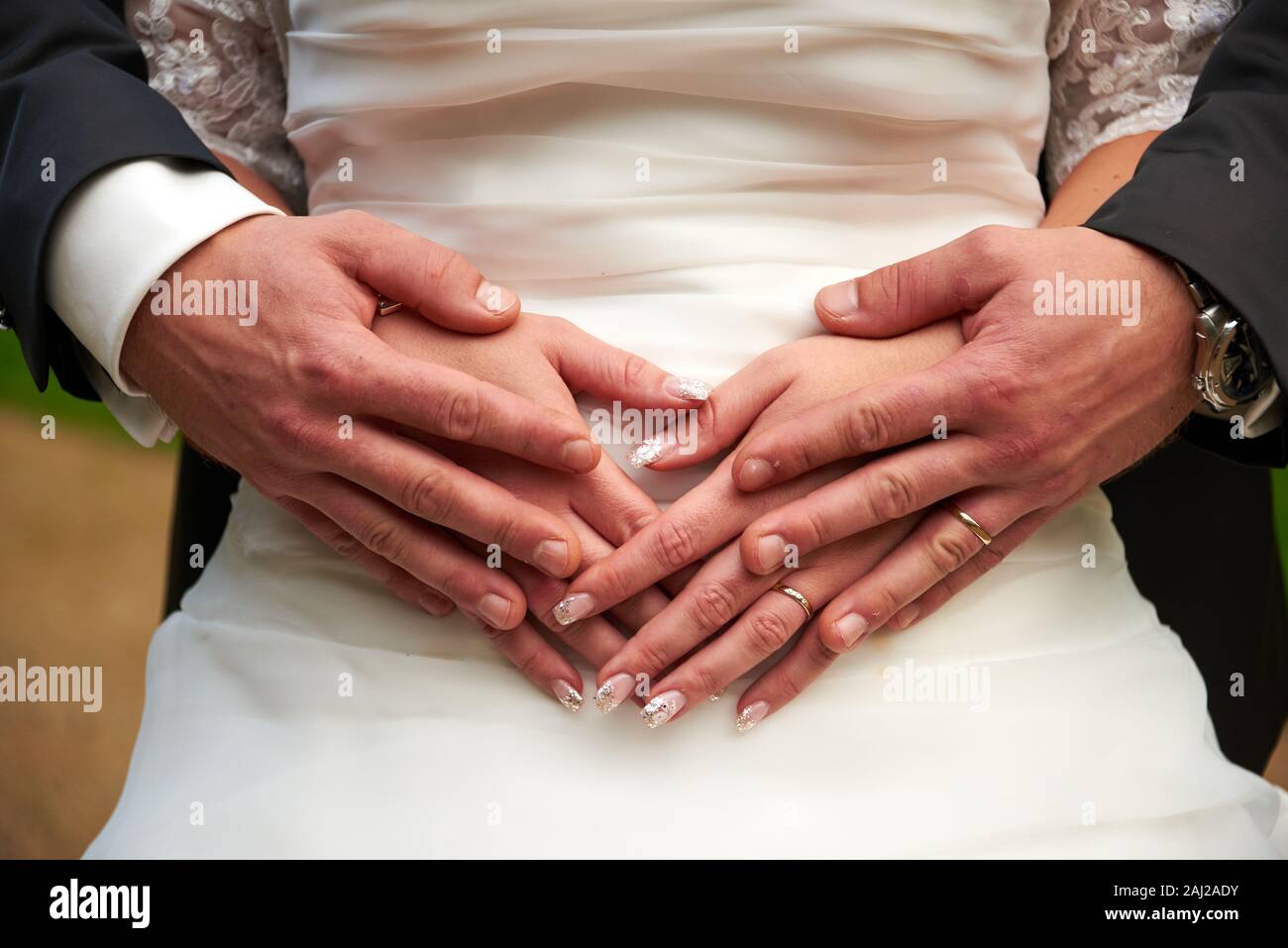 wedding couple hand in hand Stock Photo - Alamy