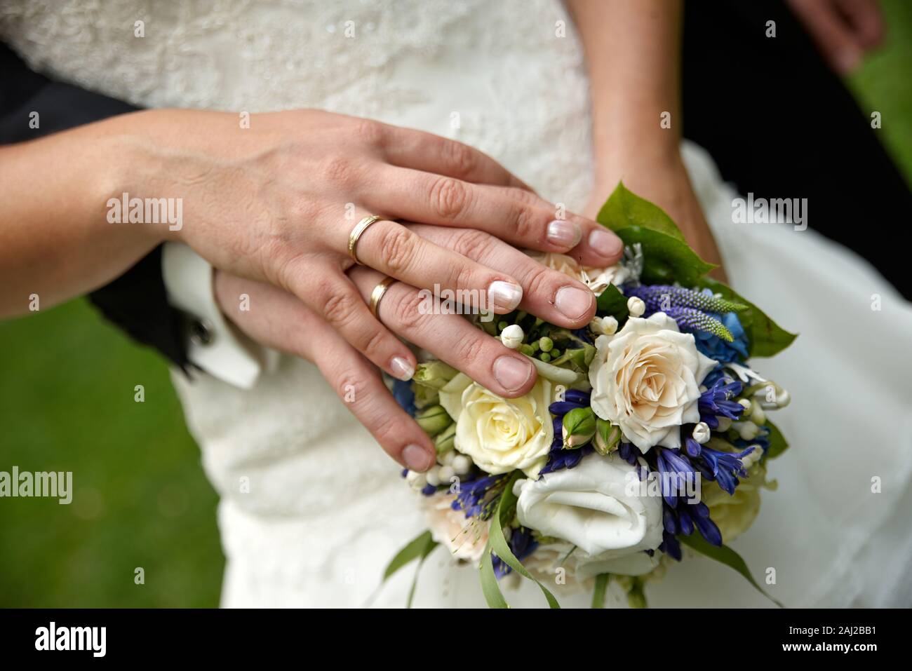 wedding couple hand in hand Stock Photo - Alamy