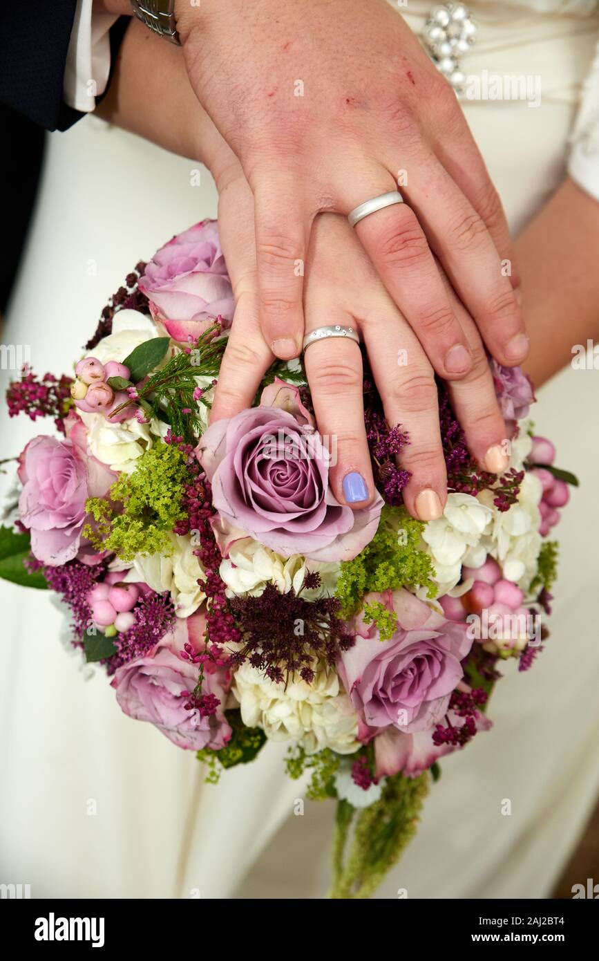 wedding couple hand in hand Stock Photo - Alamy