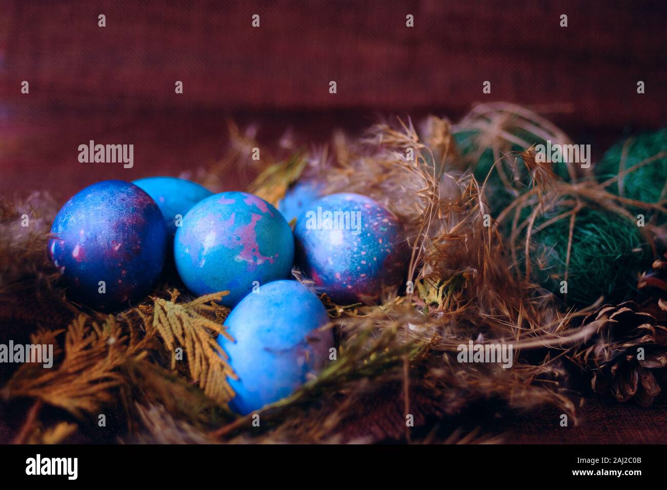 space galactic Easter eggs in nest next to cone and green filler Stock ...