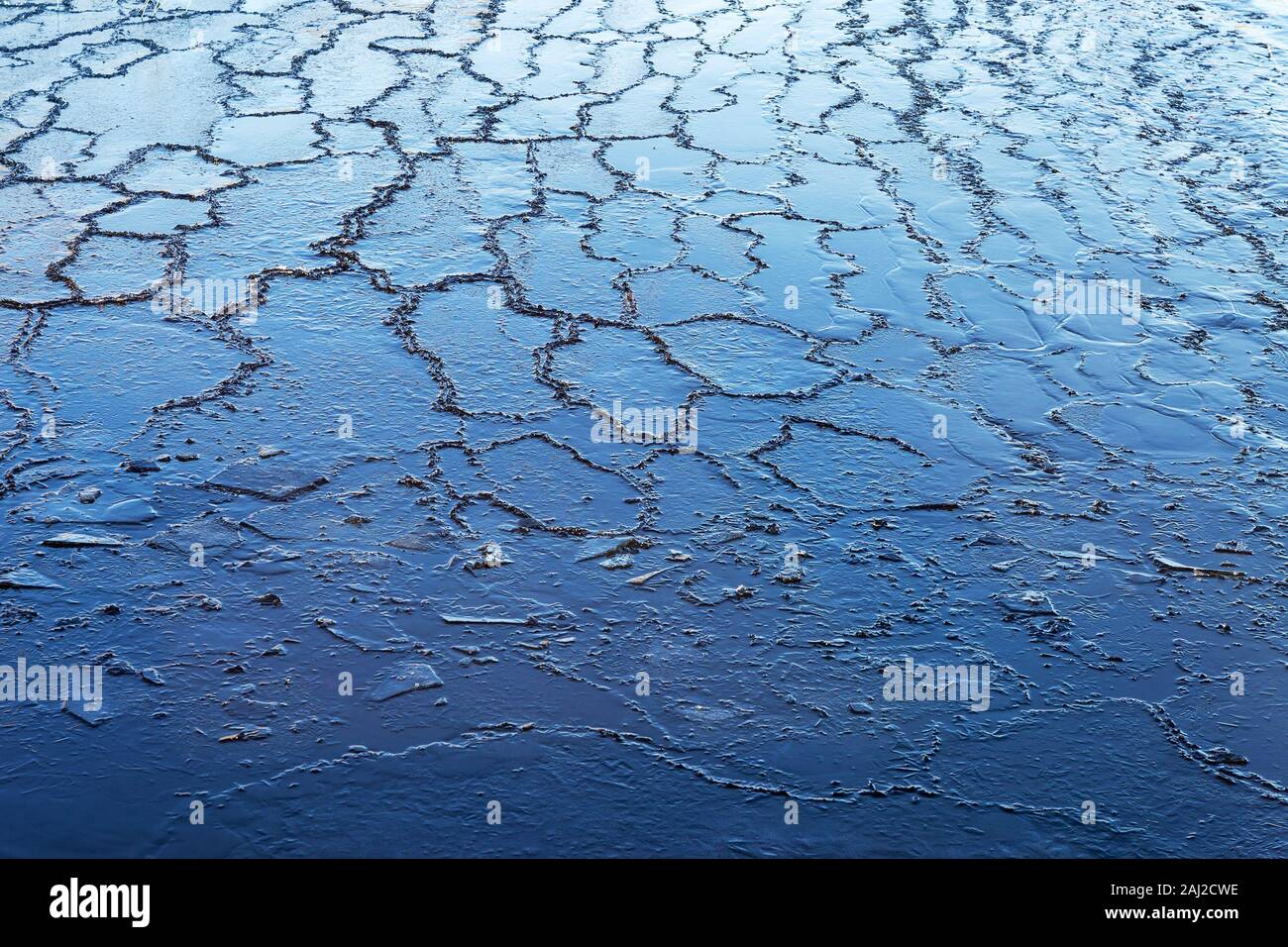 Ice on water surface in early winter Stock Photo - Alamy