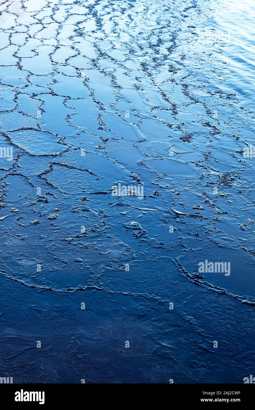 Ice on water surface in early winter Stock Photo - Alamy