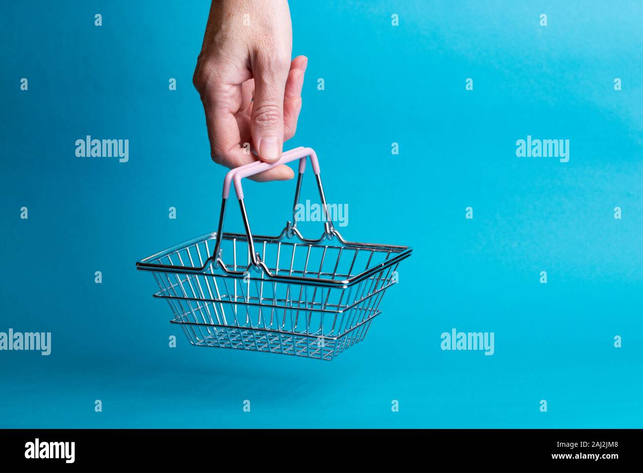 Prices for shopping consumer basket products. empty basket on a blue ...