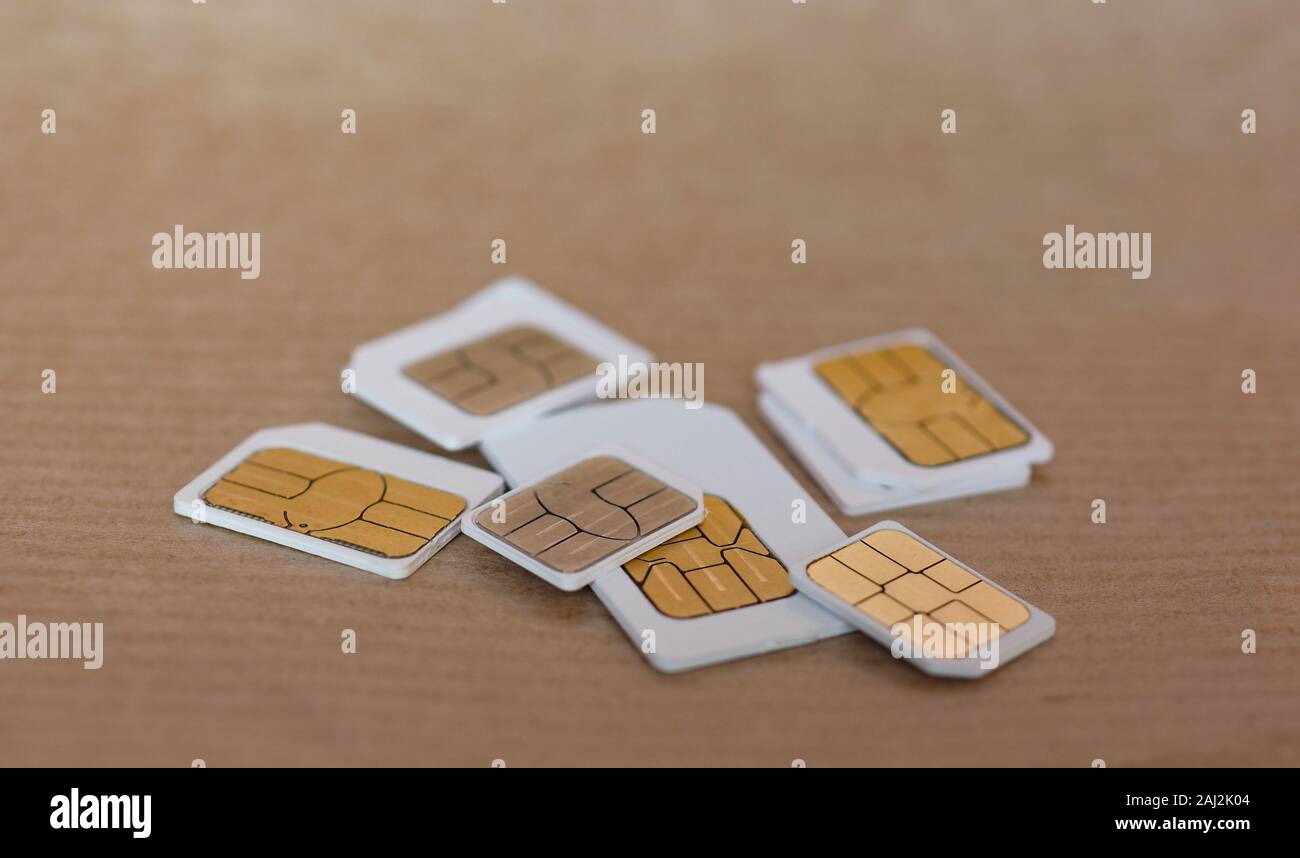 Many mini micro and nano sim cards for mobile telephone Stock Photo - Alamy