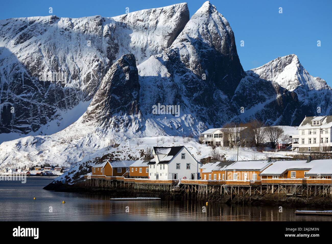 traditional norwegian wooden house rorbu to stand on the shore of the ...