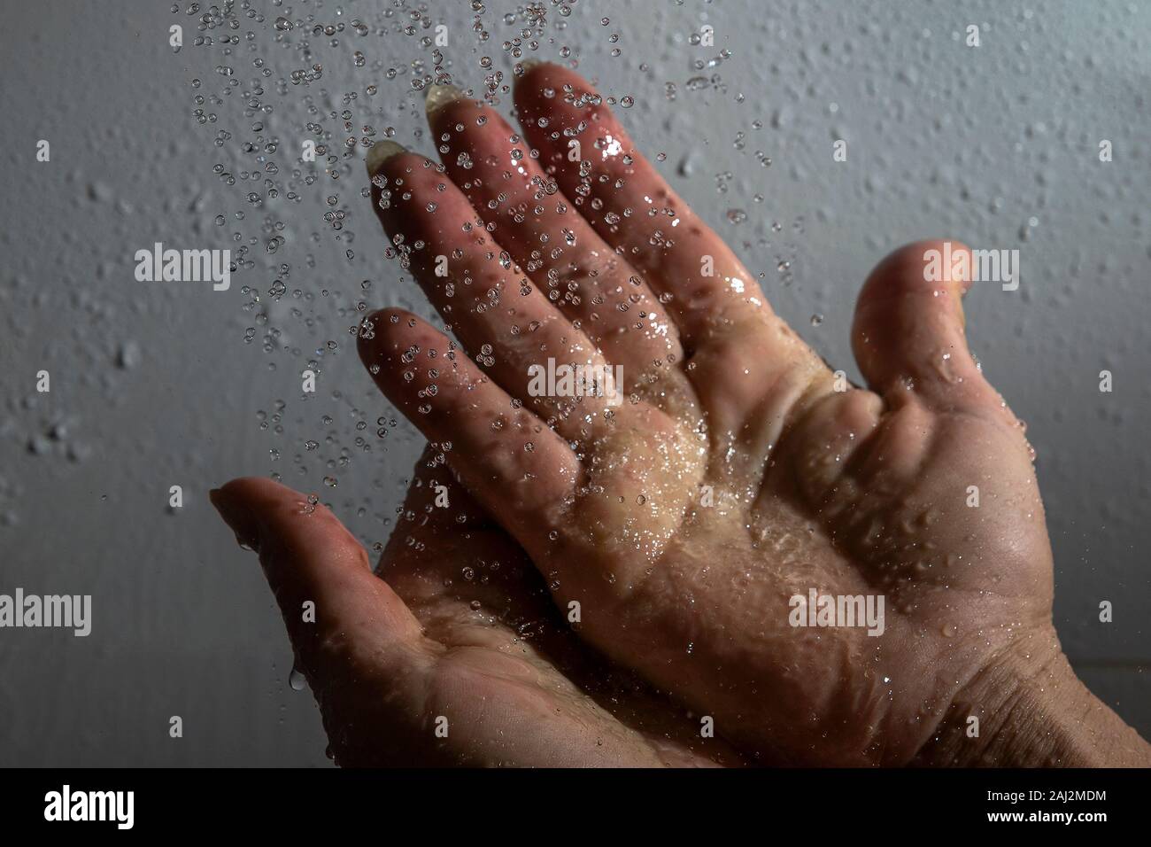 Human hand and falling water drops Stock Photo - Alamy