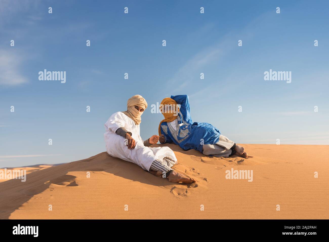 Portrait of a Bedouin nomad with colorful turban and big smile sitting ...