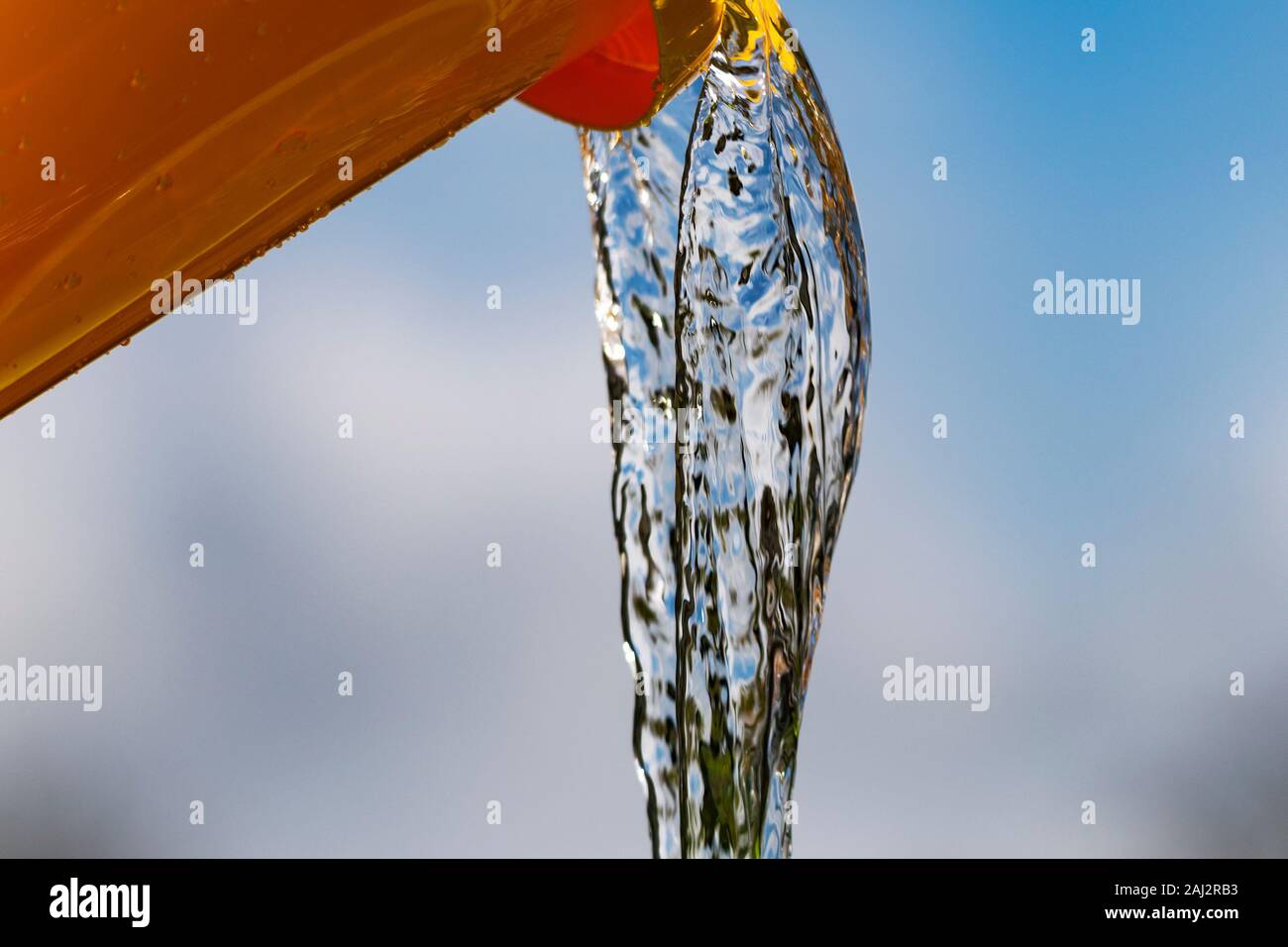 Plastic pail and pouring water Stock Photo - Alamy
