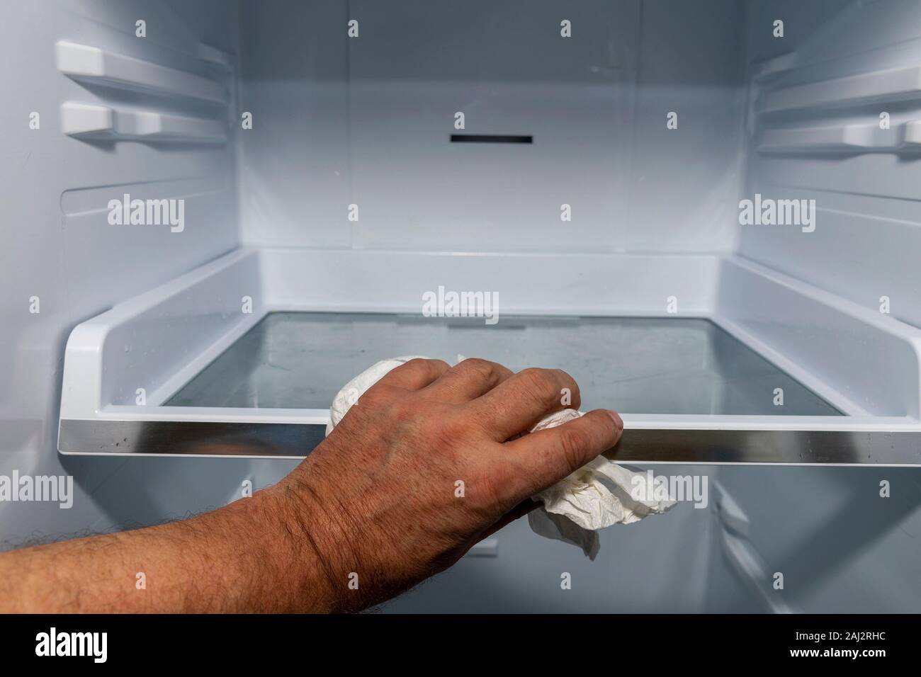 Hand cleaning inside of refrigerator Stock Photo - Alamy