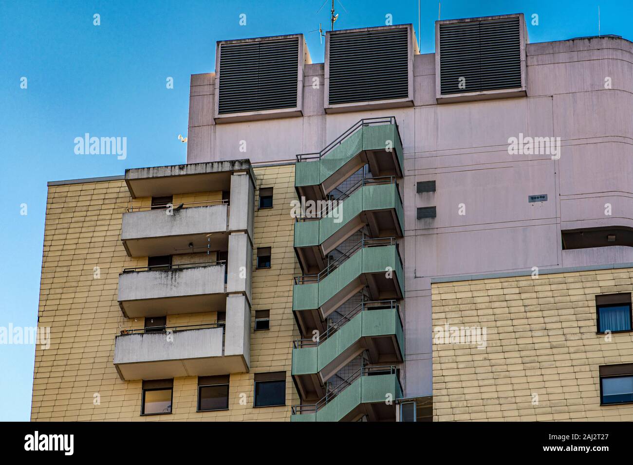 High-rise building with external staircase in the style of the eighties ...