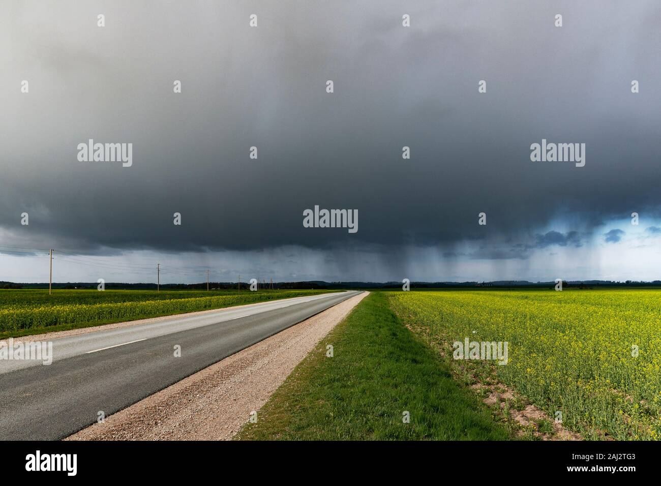 Big rain cloud and asphalt road Stock Photo - Alamy