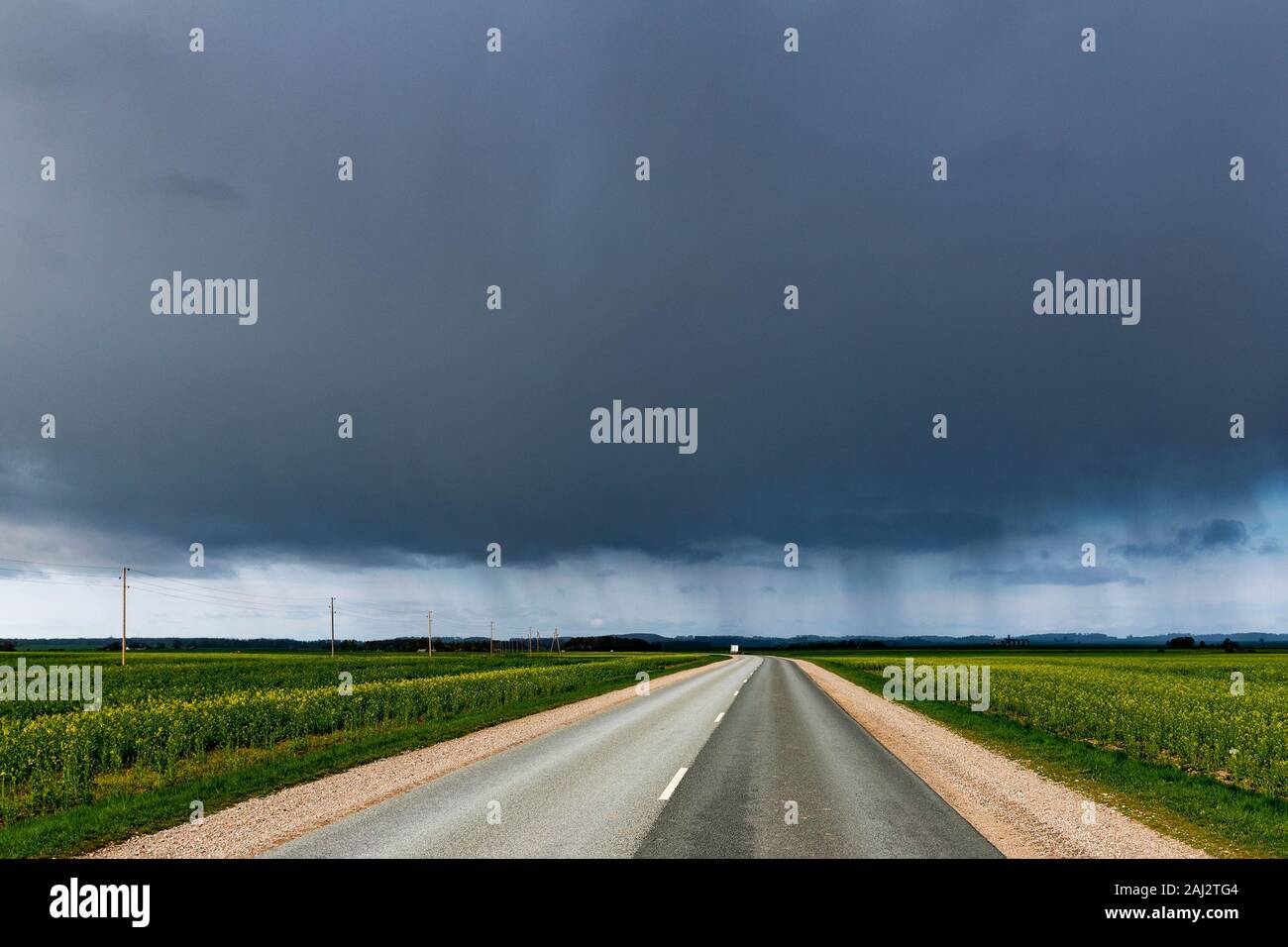 Big rain cloud and asphalt road Stock Photo - Alamy