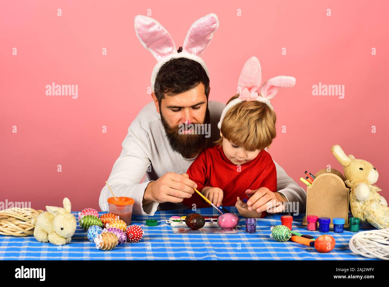 Dad with painted nose wears bunny ears. Easter celebration and joy ...