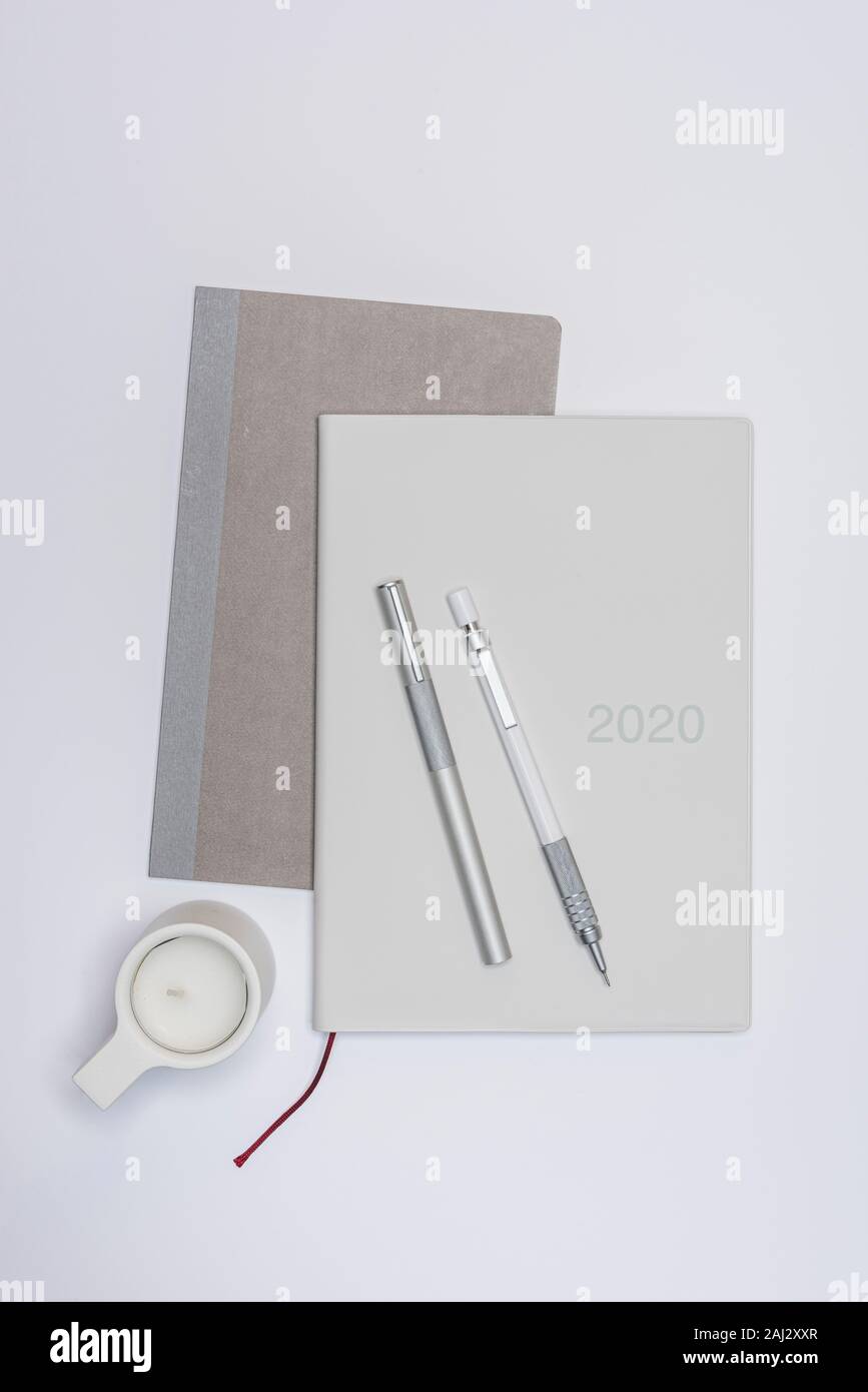 2020 Diary on a white background with various props. 30.12.2019 Please ...
