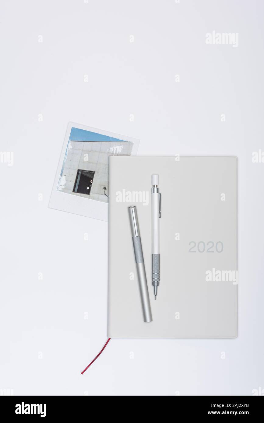 2020 Diary on a white background with various props. 30.12.2019 Please ...