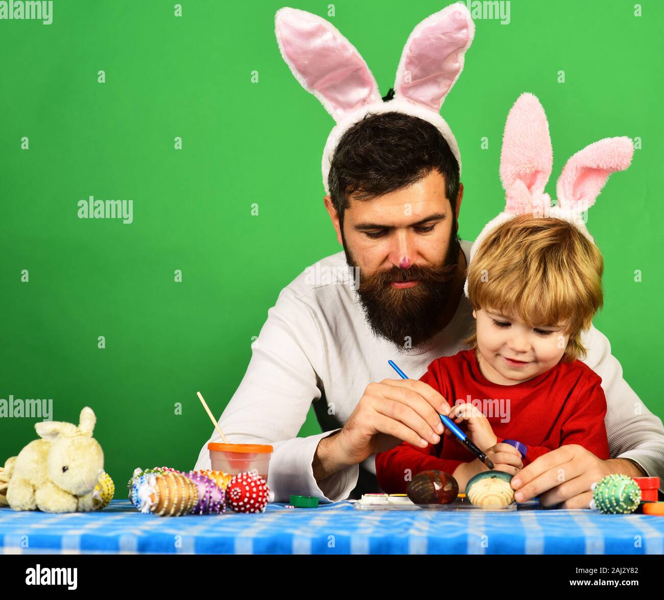 Father and son preparing for holiday. Easter celebration and joy ...