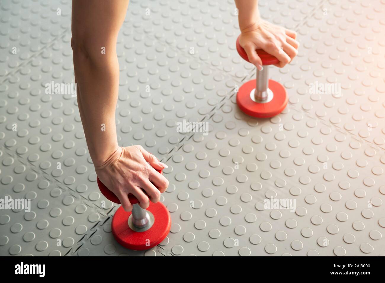 dumbbell exercise weights standing on the floor in gym Stock Photo - Alamy