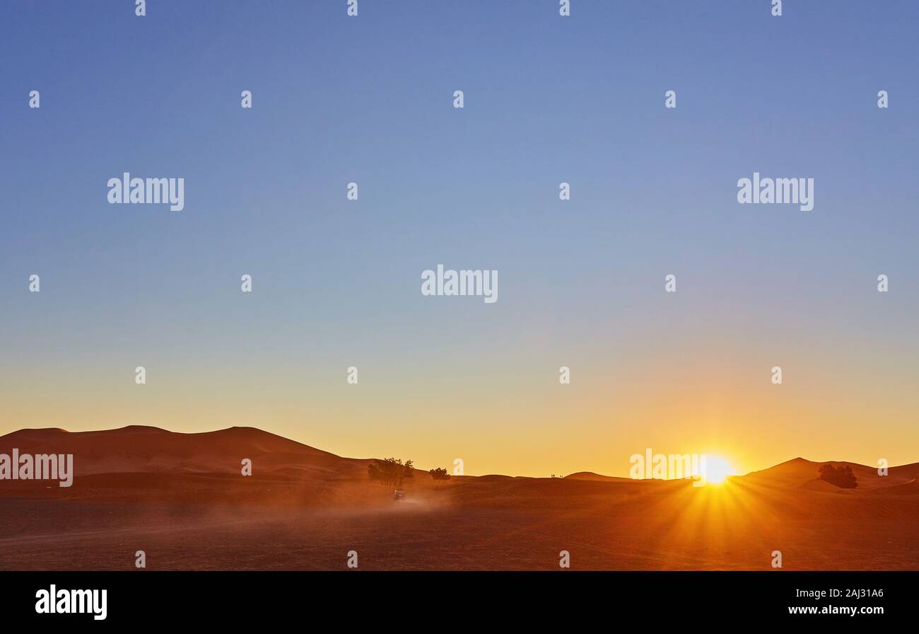 Beautiful sunset in the Sahara desert. Sand dunes at sunset Stock Photo ...