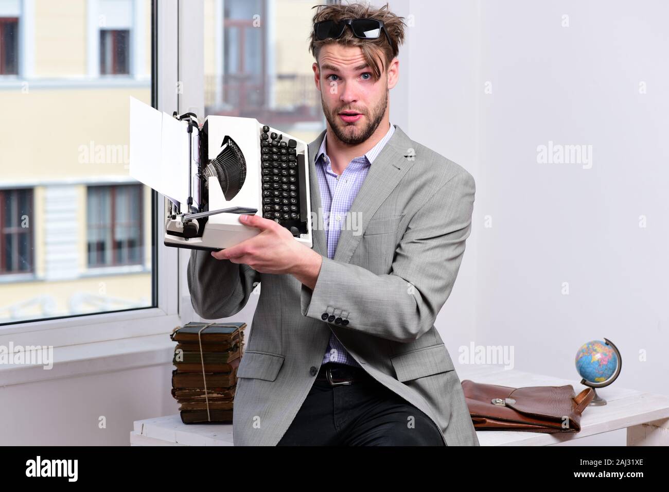 Editing and writing concept. Writer or businessman wearing grey suit ...