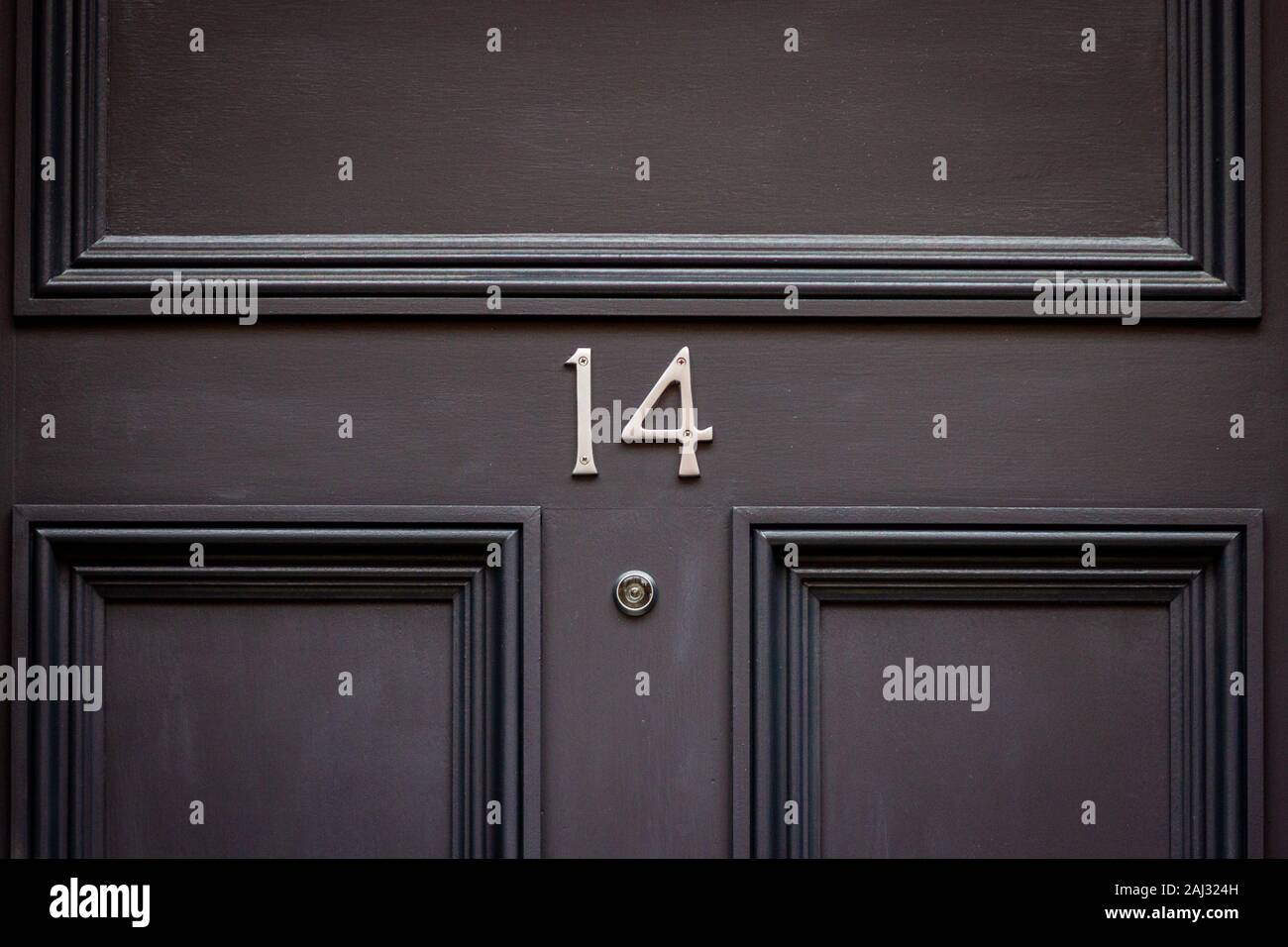 Classically elegant house number 14 on a sombre front door Stock Photo ...