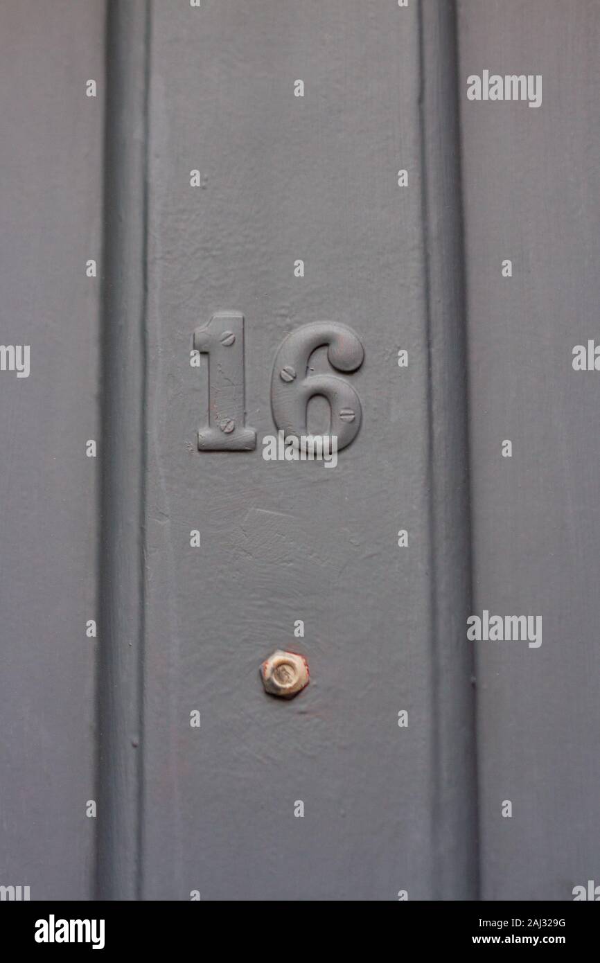 Monochrome house number 16 in gray Stock Photo - Alamy