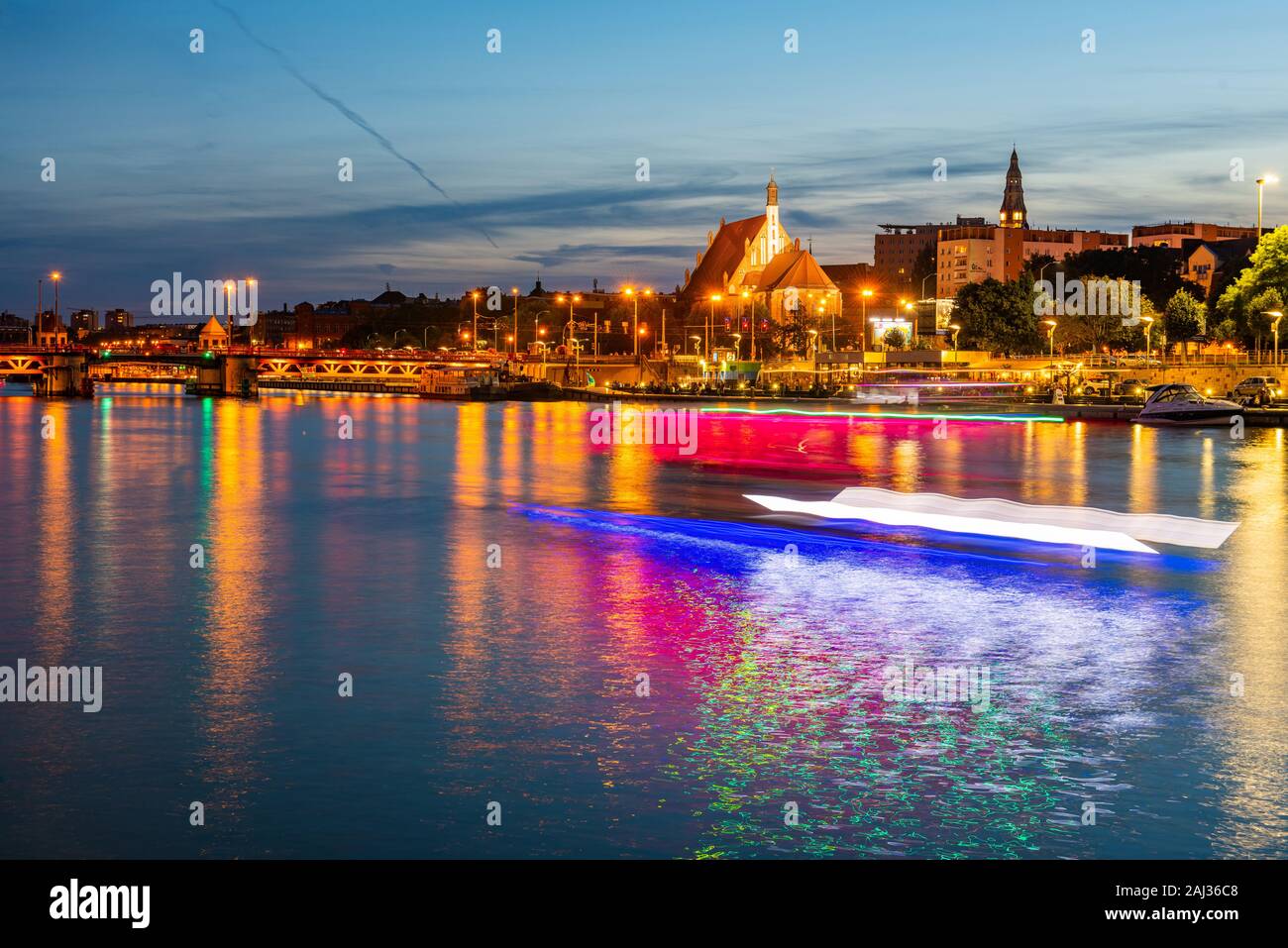 Szczecin. Night view from across the river to the illuminated historic ...