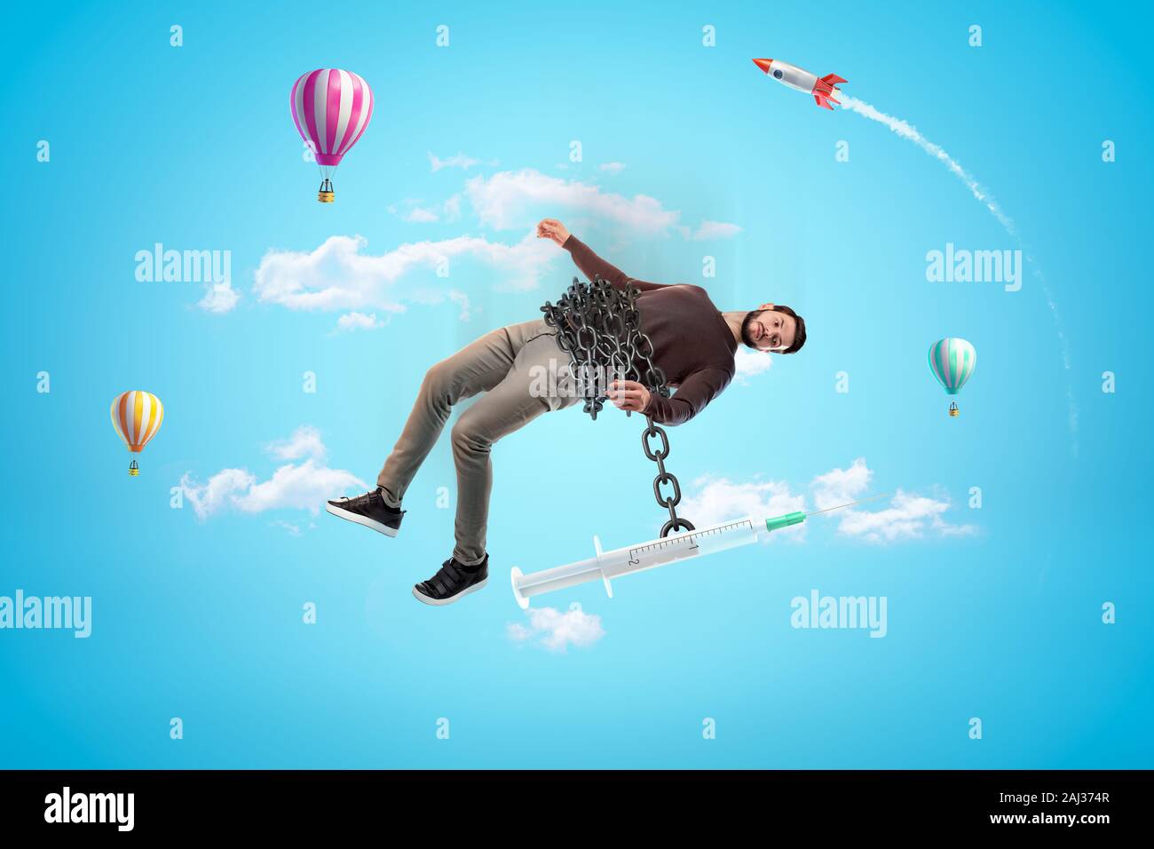 Man in blue sky with massive chain around waist with huge syringe ...