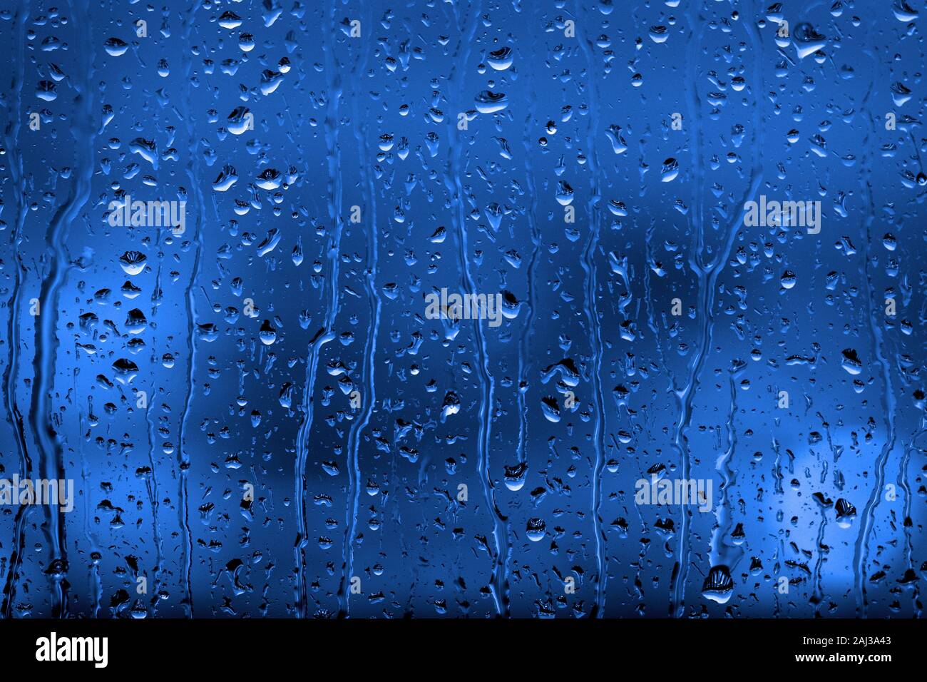 Window with rain or water drops from stormy weather Stock Photo - Alamy