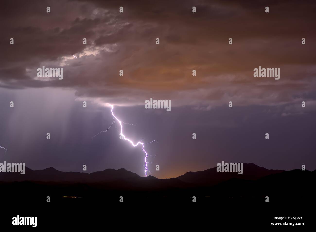 A bolt of lightning striking a mountain in an area known as the Buckeye ...