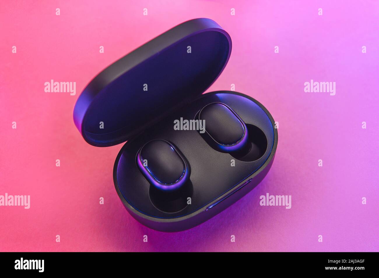 Wireless headphones on a trendy neon color gradient background Stock ...